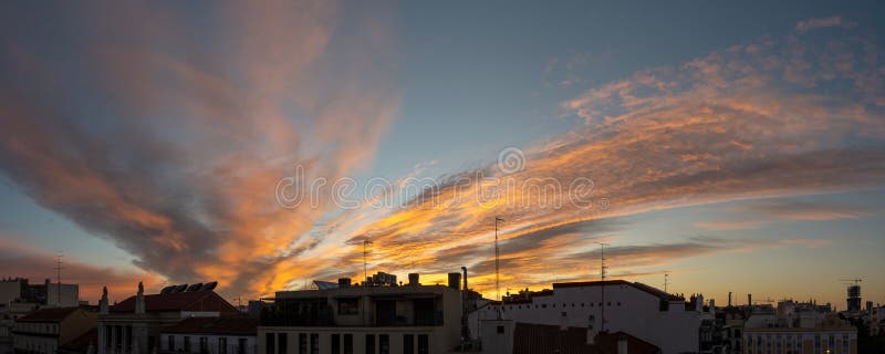 Sunrise over the rooftops stock photo. Image of clouds - 251867482