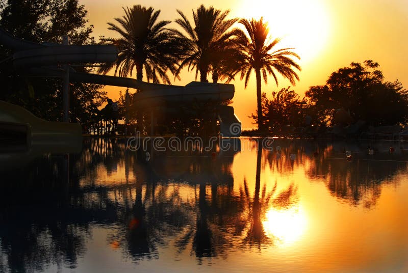 Sunrise over swimming pool stock image. Image of destination - 26734933