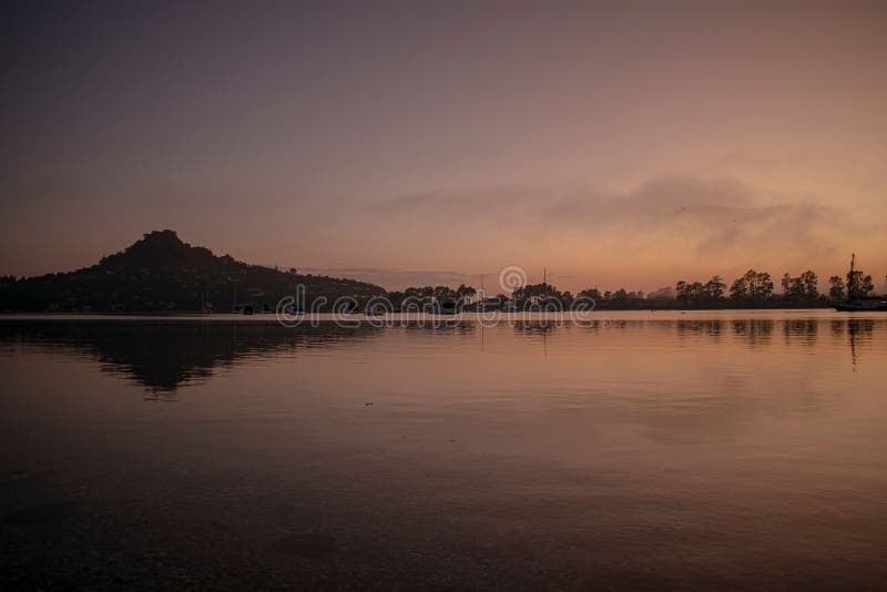 Sunrise over the harbour stock image. Image of water - 264048885