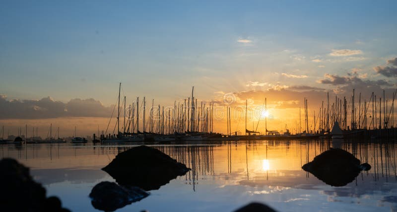 Sunrise Over Waterfront and Boats Stock Photo - Image of water, boats ...