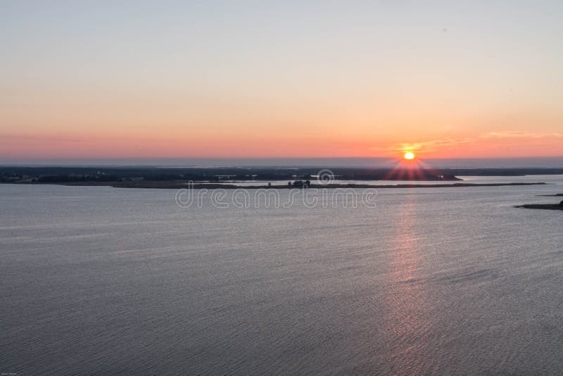 Sunrise Over the Wide River. the Sun is at the Right Edge of the Frame ...