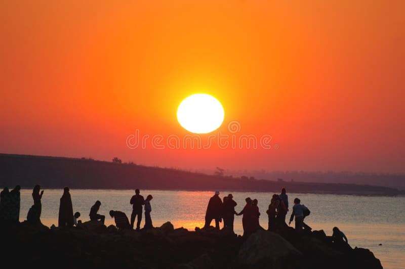 Sunrise and people 2 stock image. Image of orange, shine - 23209159