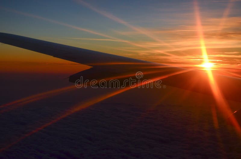 Sunrise from a plane stock photo. Image of cloud, flight - 193131480