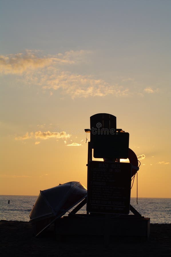 Sunrise in Racine stock photo. Image of sand, lifeguardchair - 64193882