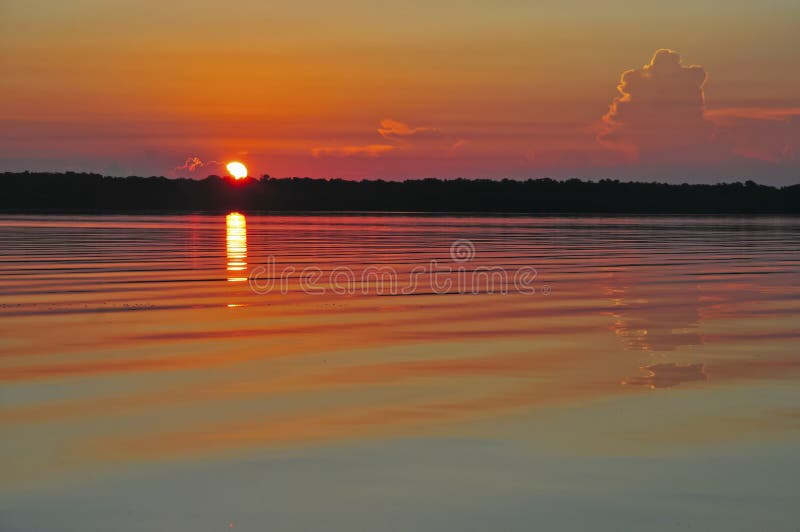 Sunrise with Reflection in Calm Water Stock Photo - Image of beach ...