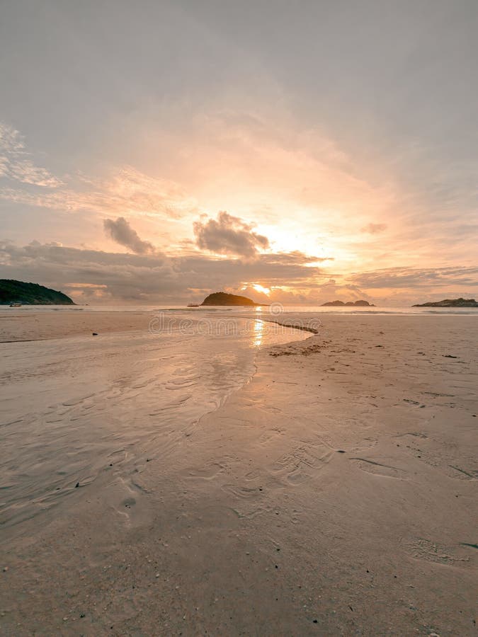 Sunrise Reflections on the Beach Sand. Textured and Watery Sandy Beach ...