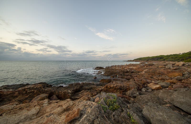 Sunrise between Rocks and the Oropesa Sea Stock Image - Image of ...