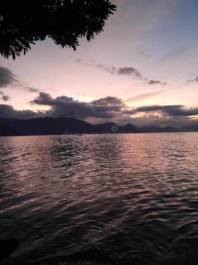 Sunrise Scene on Lake Lut Tawar Stock Photo - Image of shore, horizon ...