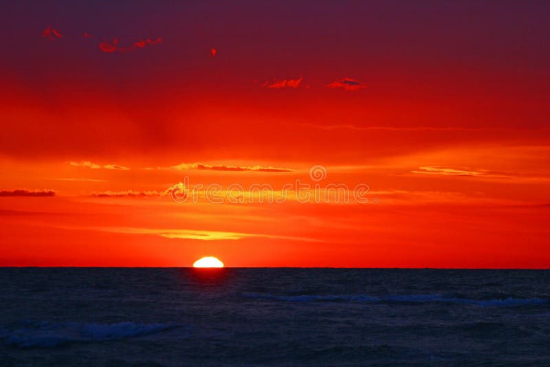 Sunrise at the Seaside, a Quarter of the Sun Comes Out of the Horizon ...