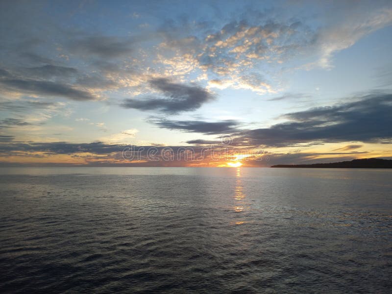 Sunrise Seen from the Ocean Stock Image - Image of ocean, sunlight ...
