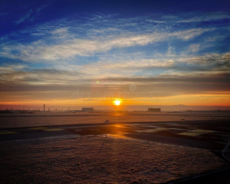 Sunrise with Flat Horizon and Distant Buildings Stock Photo - Image of ...