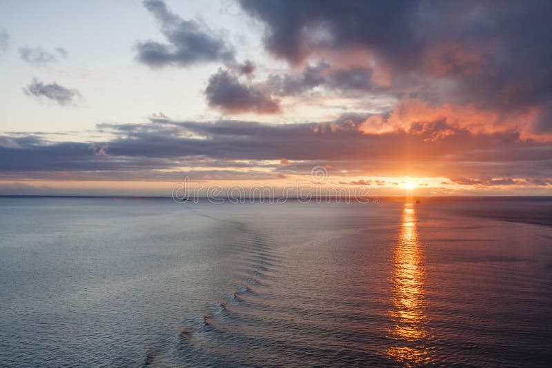 Sunrise on Ships Wake stock photo. Image of sunset, water - 28455882