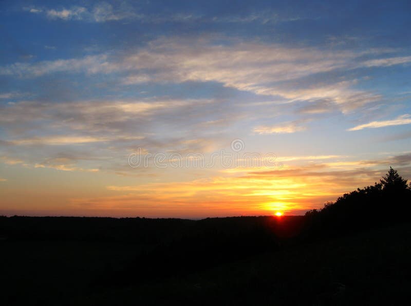 Sunset over the flatland stock photo. Image of evening - 234273152