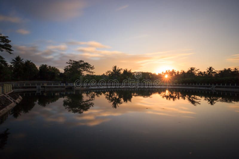 Sunrise sky stock photo. Image of treeline, reflection - 101983800