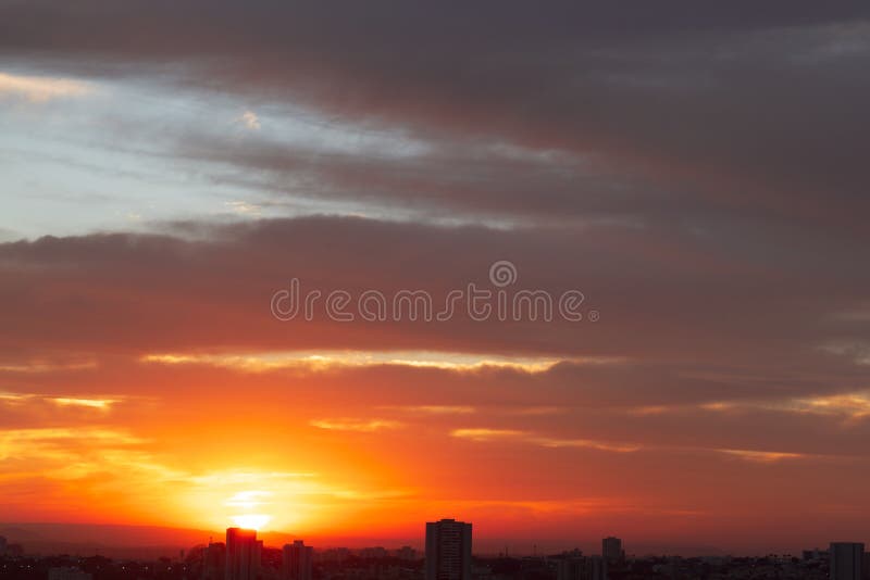 Sunrise Skyline with Red Color Fire on a Cloudy Winter Day on a City ...
