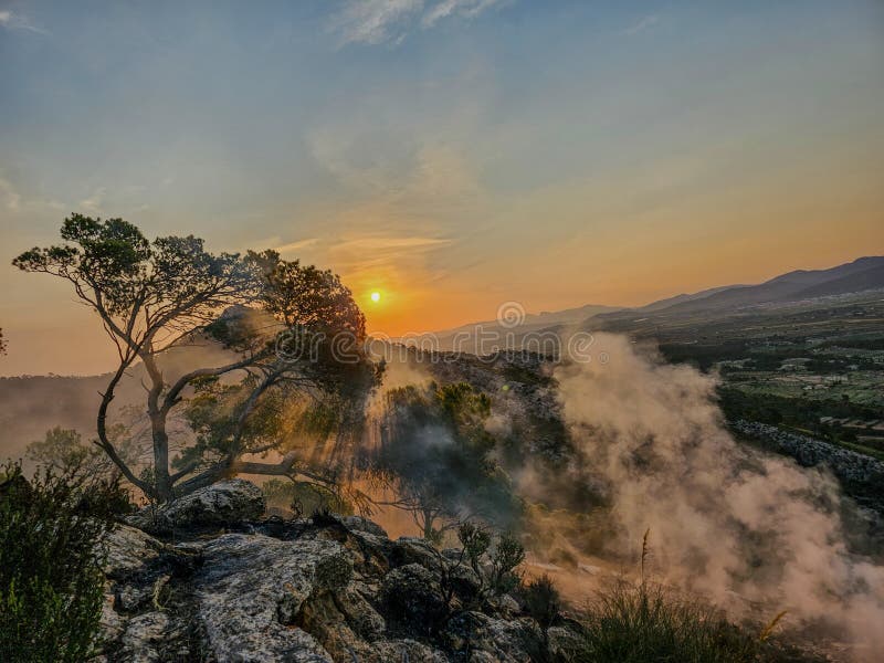 Sunrise through smoke stock photo. Image of cloudy, change - 314031976
