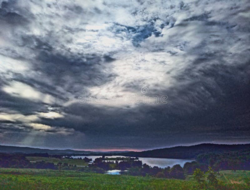 Sunrise with Storm Clouds Over a Sparkling Lake Stock Image - Image of ...