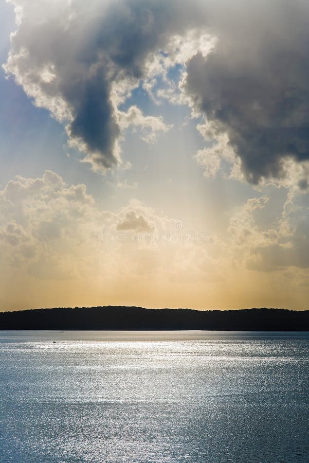 Sunrise / Sunset Light Rays Over Lake Stock Image - Image of glow ...