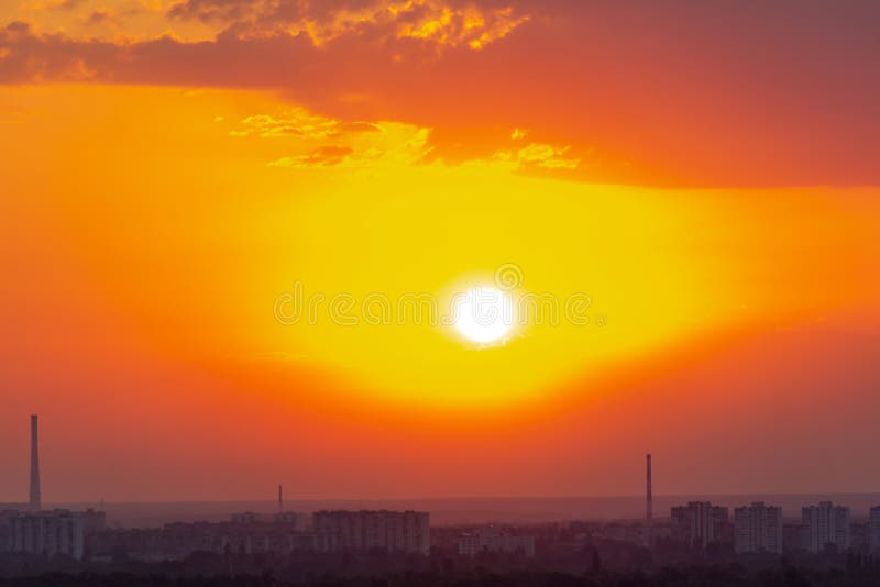 Sunrise, Sunset Over the City, the Sun Coming Out of the Clouds Stock ...