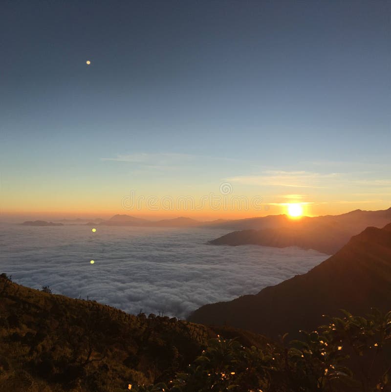 Sunrise on top of mountain stock image. Image of sunset - 267920493