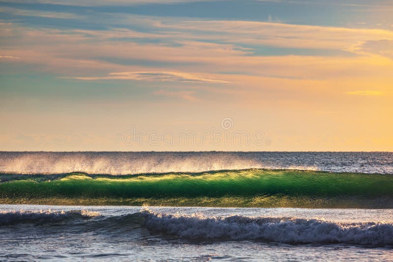 Beautiful Green Sunrise Wave and Scenic Sunrise Clouds Stock Photo ...