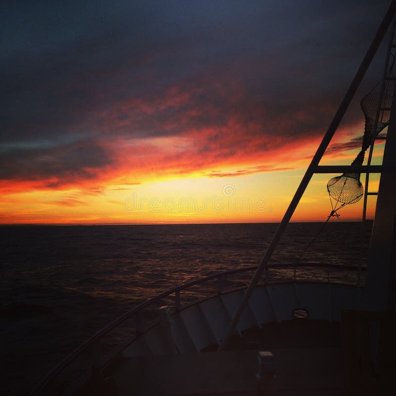 Sunrise at work stock image. Image of boat, sunrise, sunset - 55118923