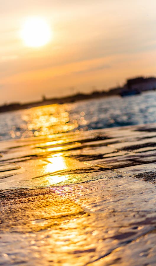 The Suns Reflection in the Water Creates a Beautiful Amber Afterglow at ...