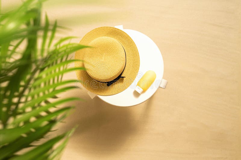 Sunscreen for Protection Skin and Straw Hat on the White Table on the ...