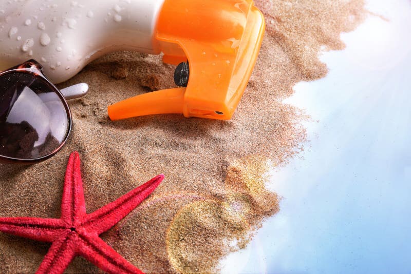Sunscreen Spray and Sunglasses on Sand in Table Stock Photo - Image of ...