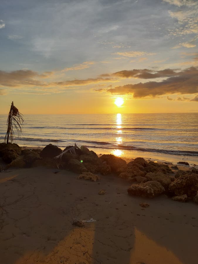 Sunseet on the Beach Tanisi Indonesia Stock Image - Image of sand ...