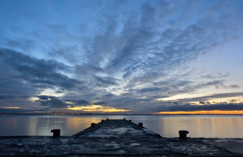 Sunset stock image. Image of sunset, water, pier, city - 12249111
