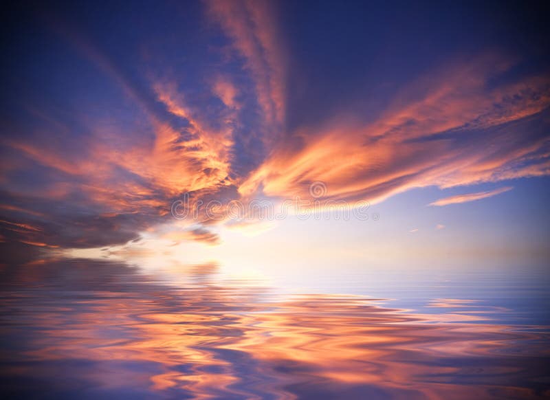 Reflection of Beautiful Sunset / Majestic Clouds and Sun Above Stock ...