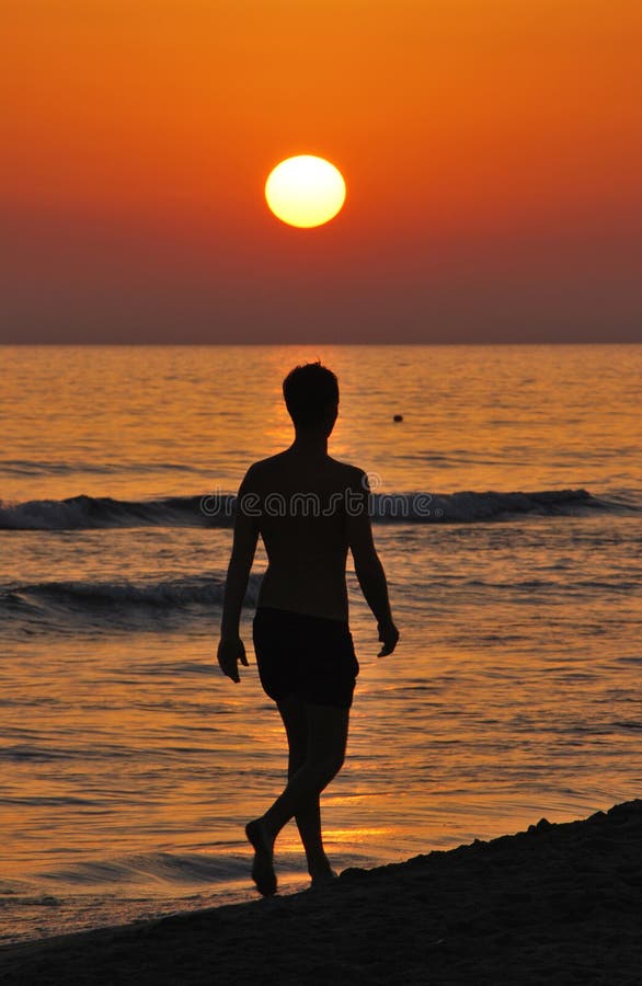 Sunset with man in boat stock photo. Image of shadow, ocean - 34454