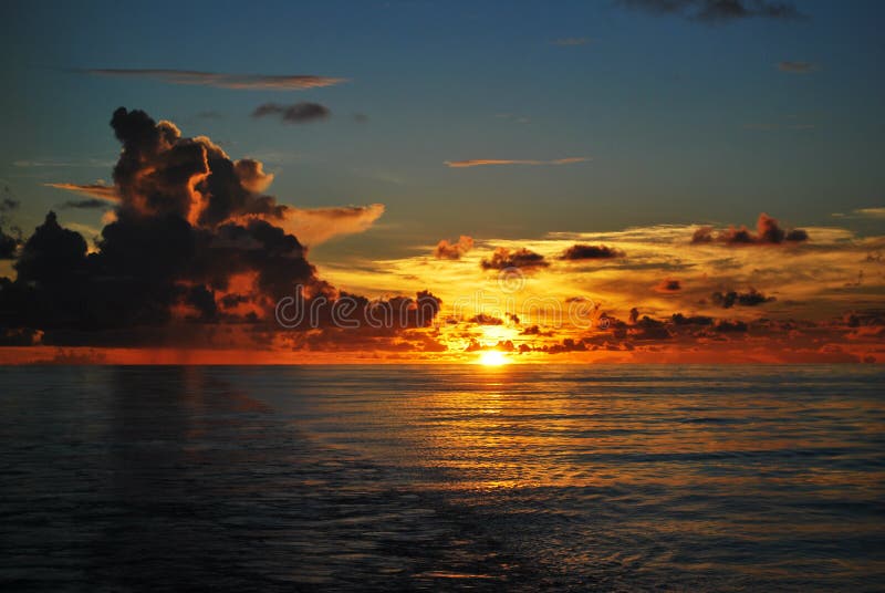 Ship wake at sunset stock photo. Image of sunset, water - 22692630