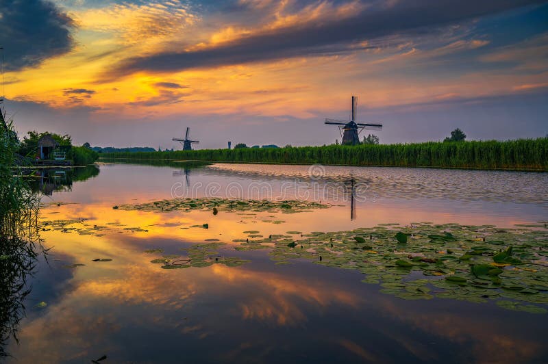 Sunset Above Old Dutch Windmills in Kinderdijk, Netherlands Stock Image ...