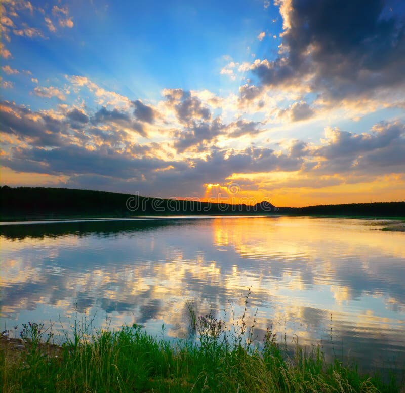 Red sunset on lake stock photo. Image of cloudy, sunrise - 12661050