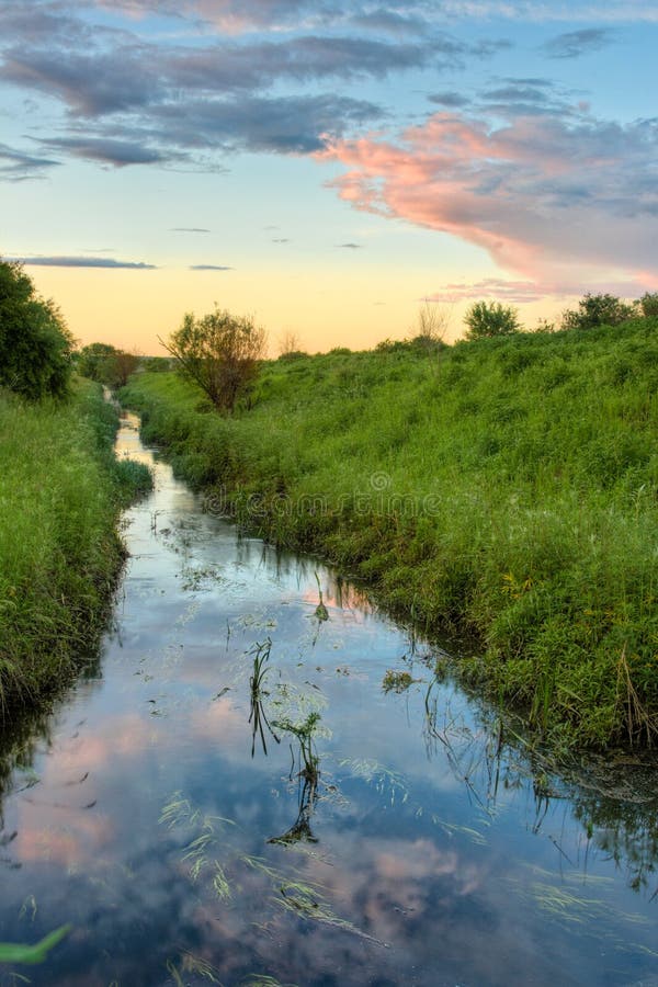 Sunset above the stream stock photo. Image of tranquil - 10360384