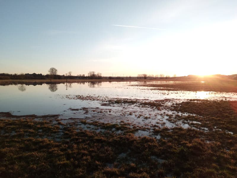 Sunset Above Water in Field & X28;Medium& X29; Stock Photo - Image of ...