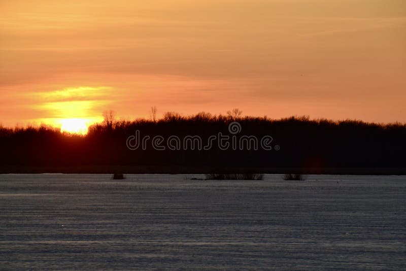 Sunset Across Ice Covered Lake at Tiny Marsh Stock Image - Image of ...