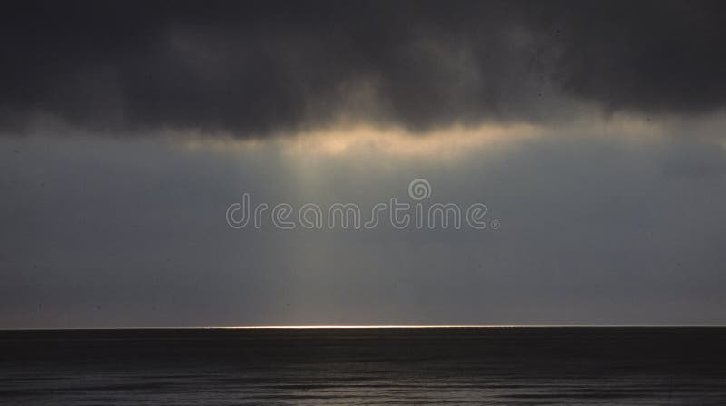 Sunset at the Adrian Sea with Dark Clouds and Spectacular Reflection ...