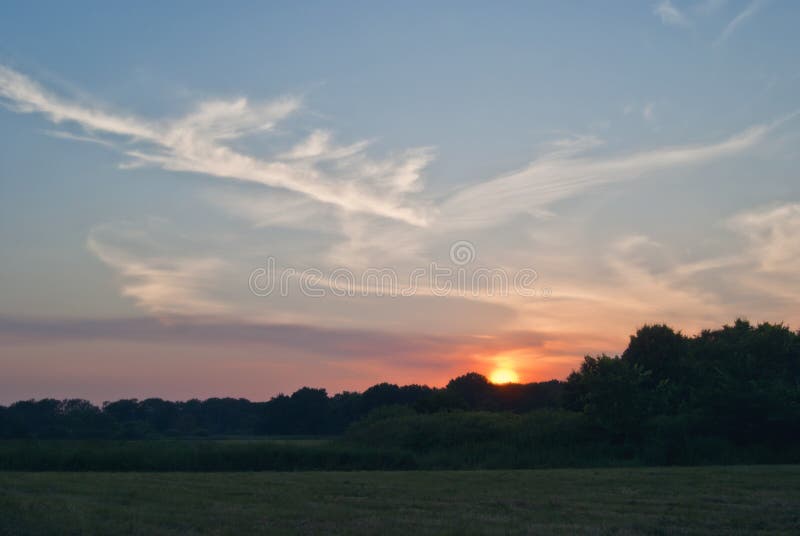 Sunset Against a Background of Rare Clouds Stock Photo - Image of ...