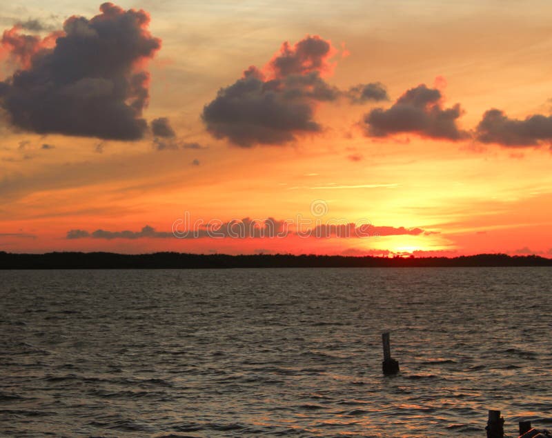 Sunset Along the Shore stock photo. Image of brilliant - 59177056