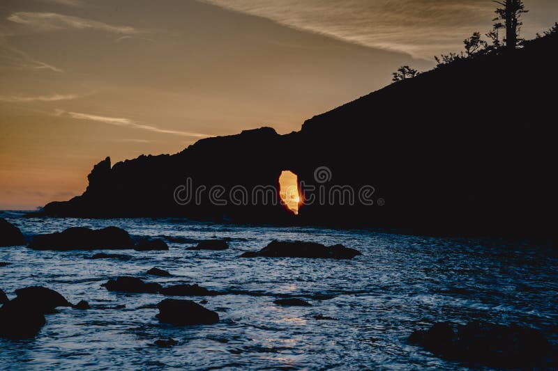 Sunset through Arched Rock at Lapush, Ruby Beach, Washington Stock ...
