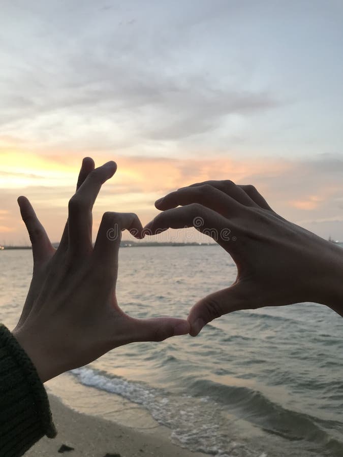 Beach and Sunset Shot from Angle View Stock Photo - Image of sitting ...