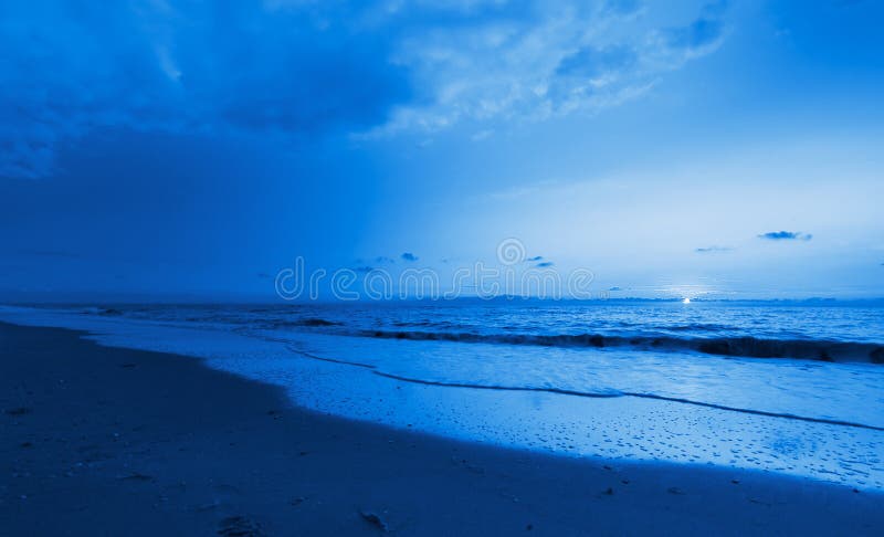 Midnight Blue Coastal Moonrise with Dramatic Sky and Rolling Waves ...