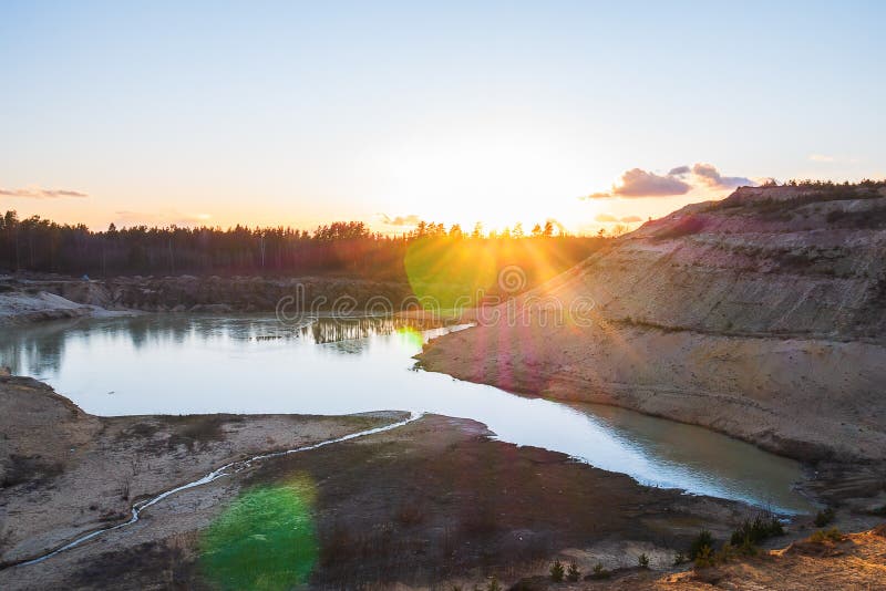 Sunset in a quarry stock image. Image of sunset, turquoise - 242822675