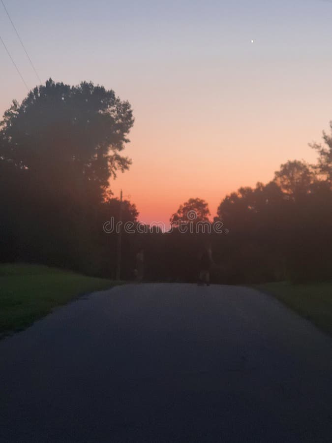 Sunset on a Backroad stock image. Image of reds, pinks - 227826207