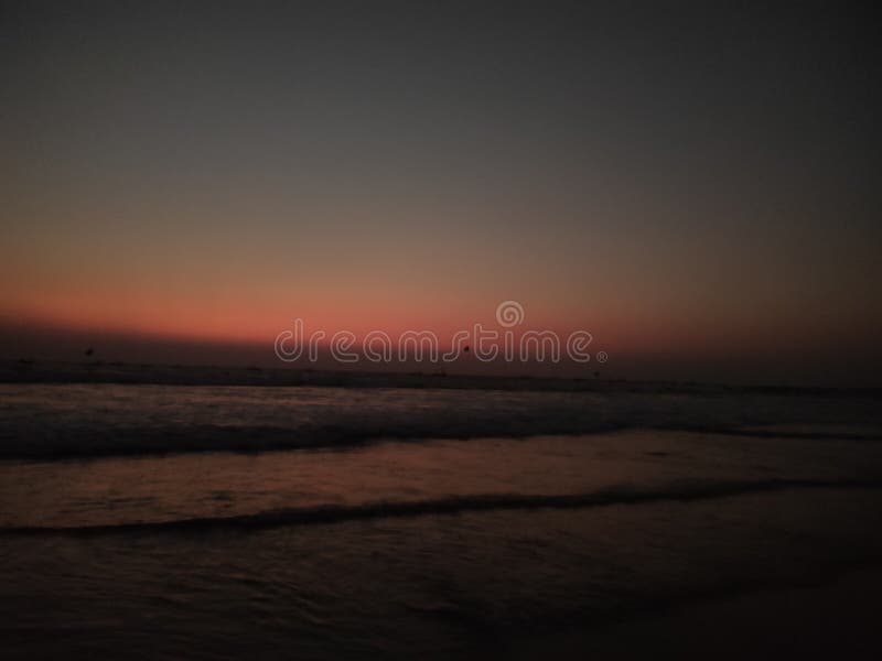 Sunset at Baga beach Goa stock photo. Image of dawn - 267610660