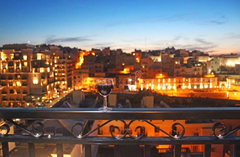 Sunset-balcony-wineglass stock photo. Image of catching - 89257926
