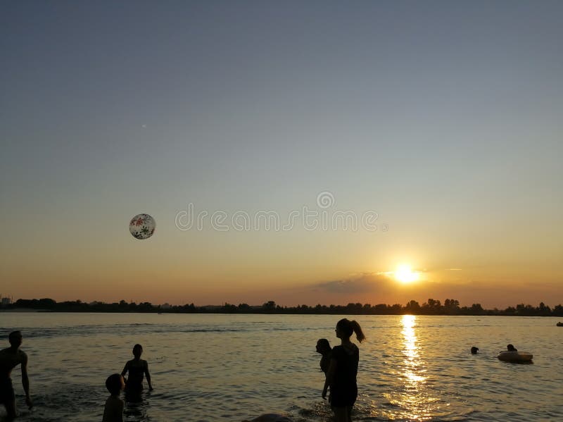 Sunset. Ball Game in the Water on the Beach. Editorial Stock Photo ...
